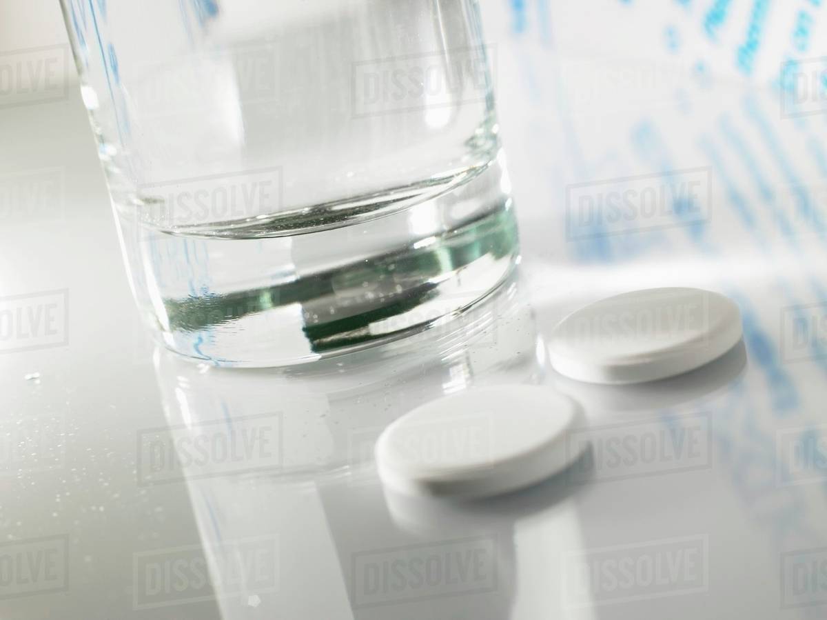 Empty tumbler and two effervescent tablets - Royalty-free Stock Photo ...