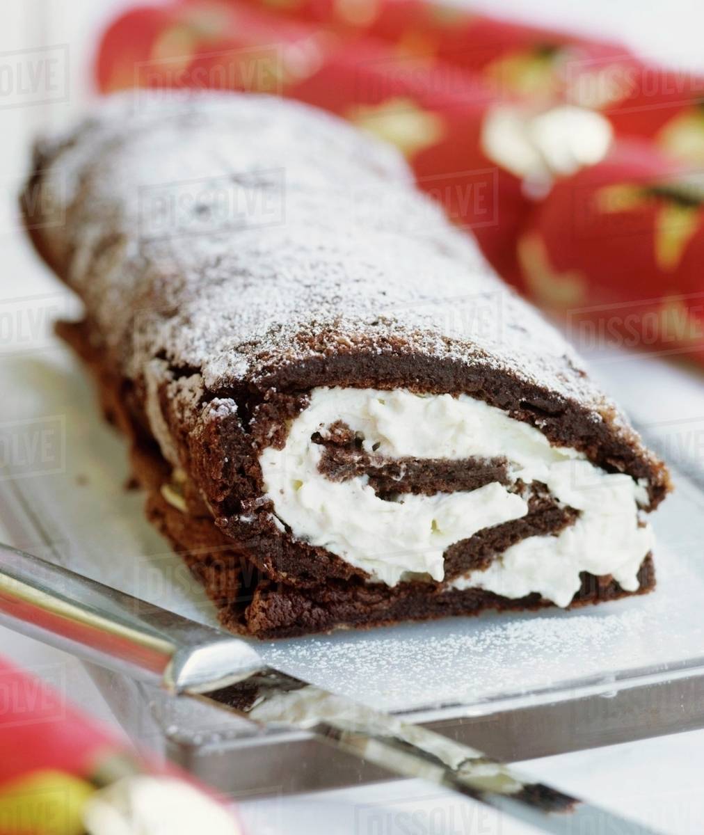 Chocolate sponge roulade for Christmas - Stock Photo - Dissolve