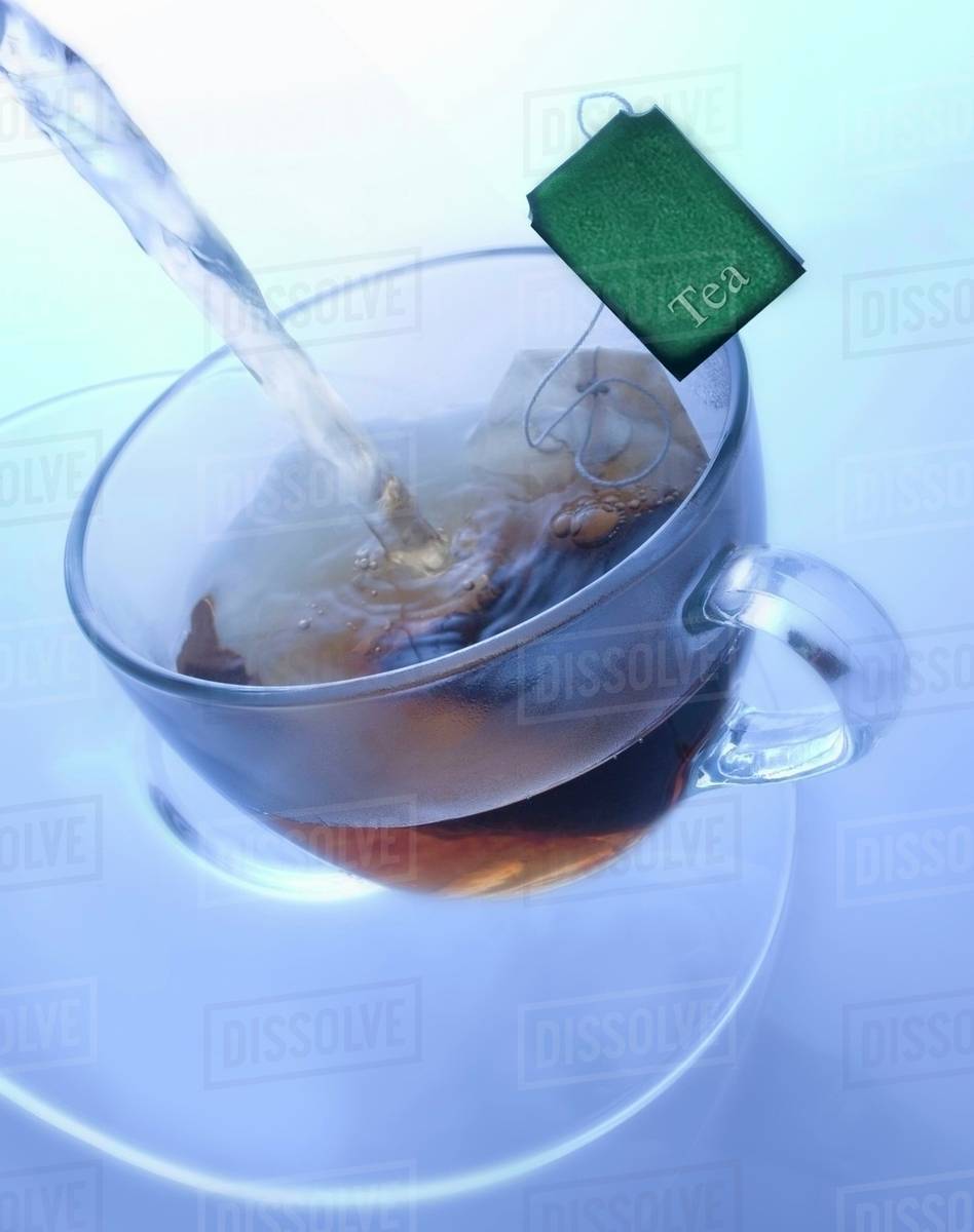 Pouring boiling water onto tea bag - Royalty-free Stock Photo | Dissolve