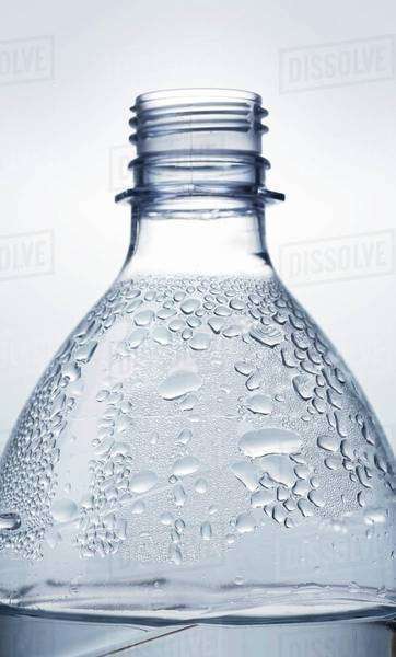 Plastic water bottle with condensation - Stock Photo - Dissolve