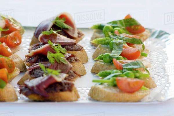 Assorted canapes on a tray - Stock Photo - Dissolve