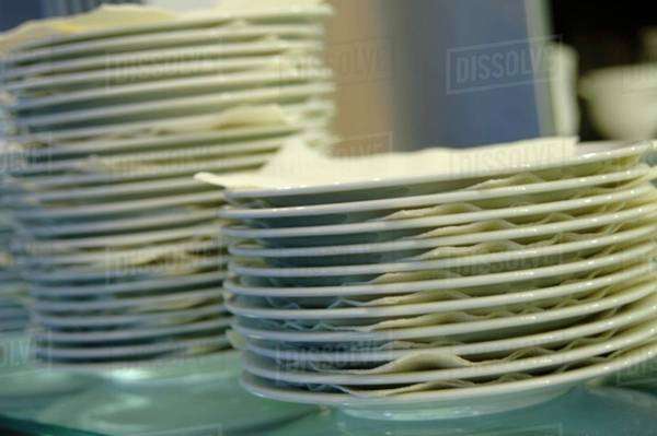 Several piles of plates - Royalty-free Stock Photo | Dissolve