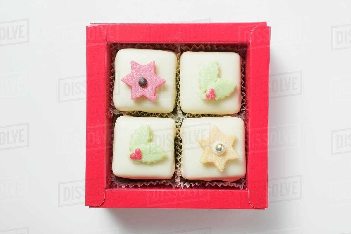 Petit fours in red box (for Christmas) - Stock Photo - Dissolve