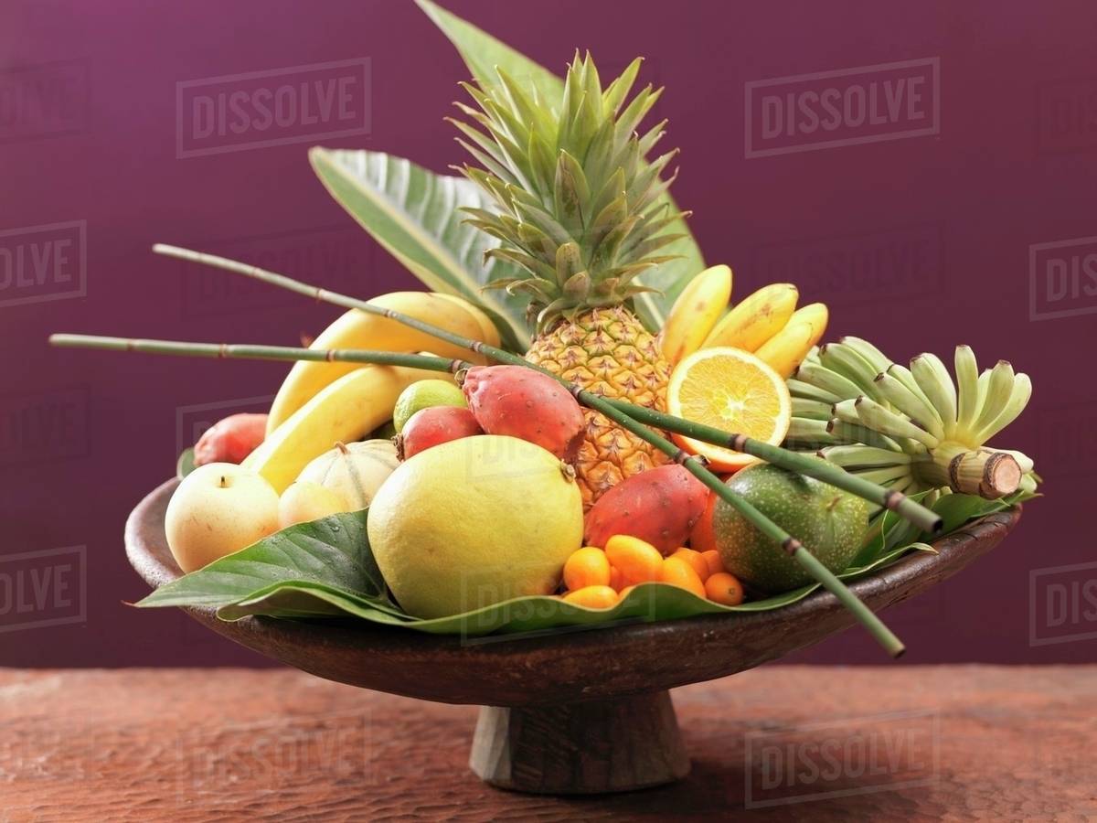Still life: exotic fruit in wooden bowl - Royalty-free Stock Photo ...
