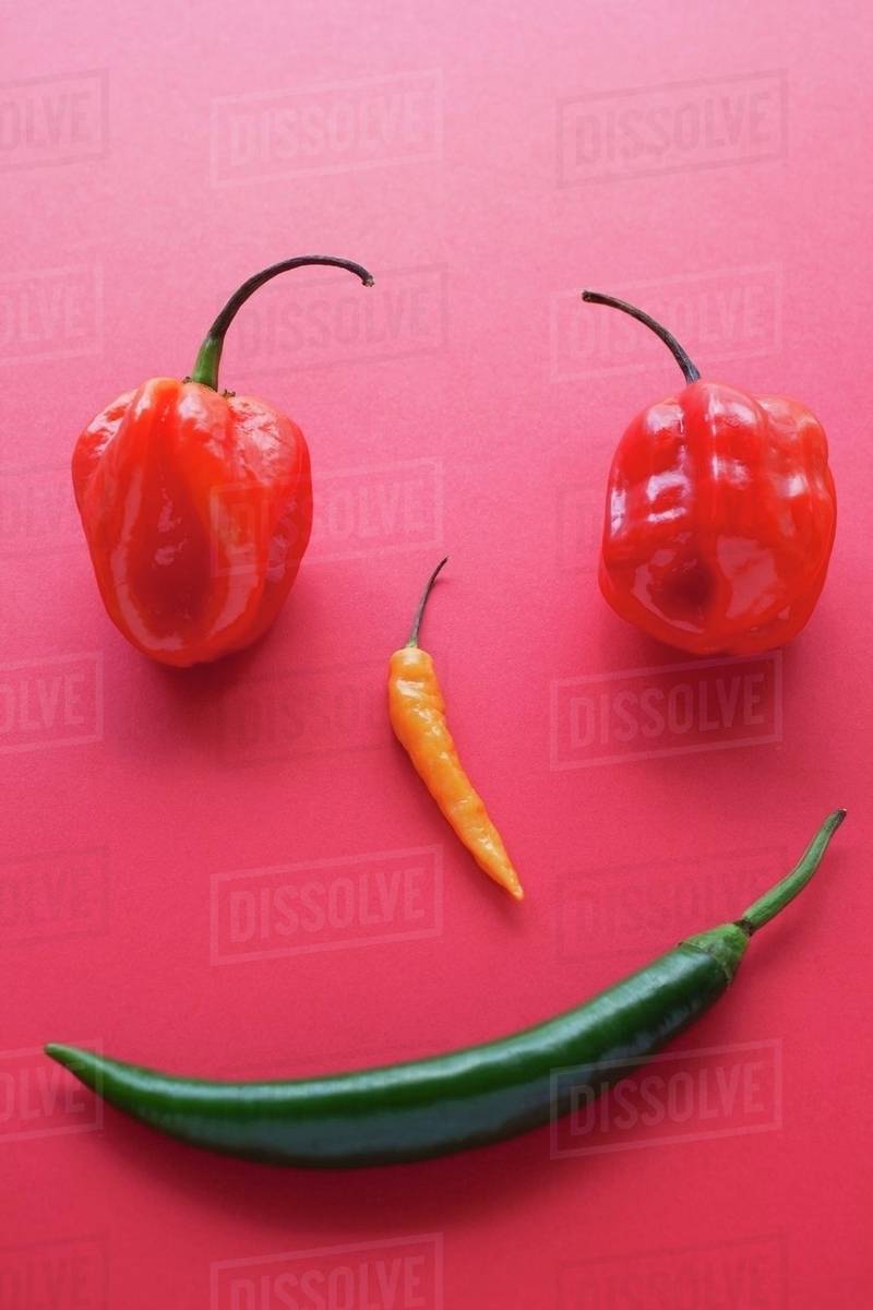 A face made of chilli peppers - Stock Photo - Dissolve