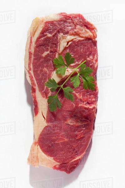 A raw ribeye steak - Royalty-free Stock Photo | Dissolve