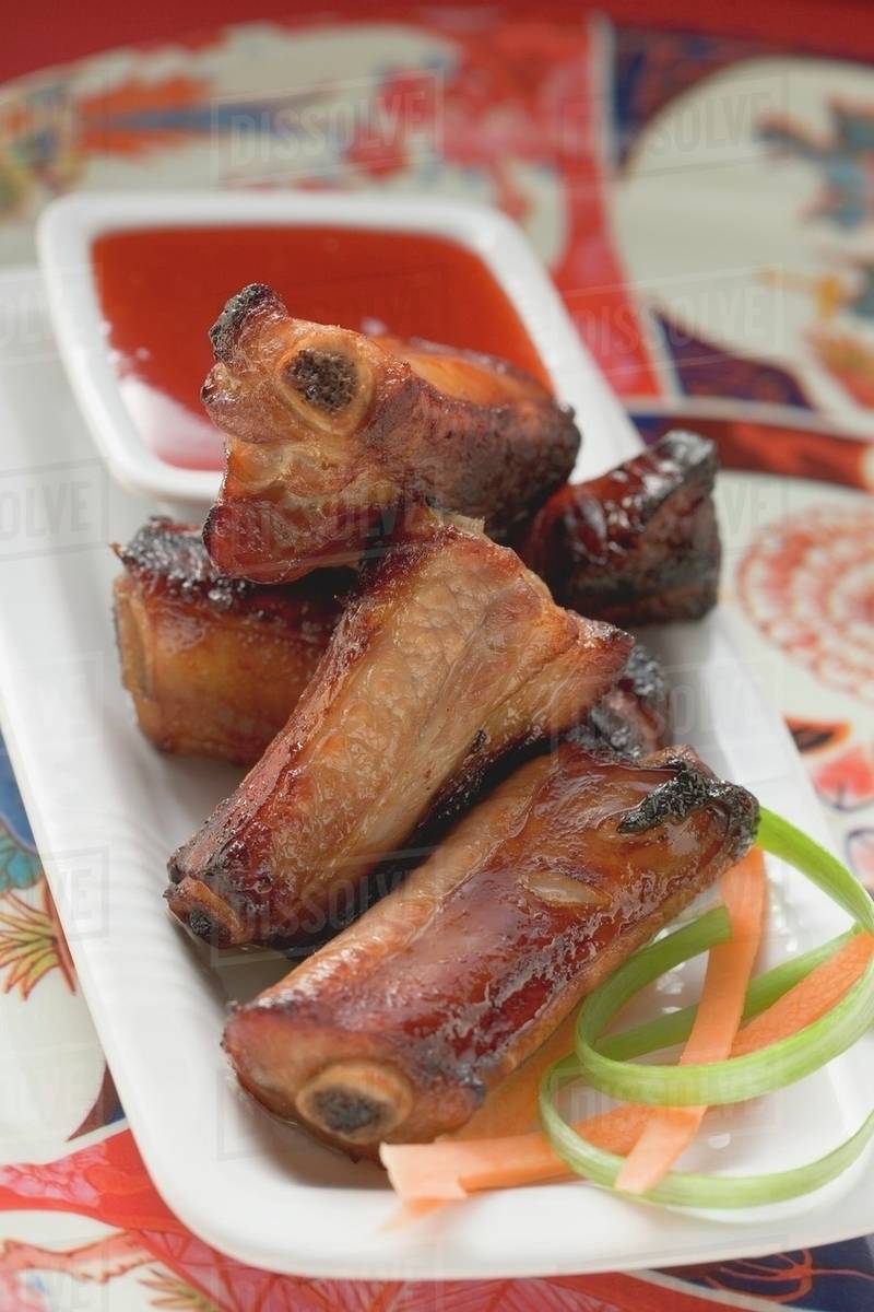 Crispy fried pork ribs with sauce (Asia) - Stock Photo - Dissolve