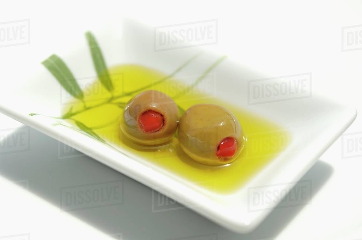 Stuffed olives in olive oil (Spain) - Royalty-free Stock Photo | Dissolve