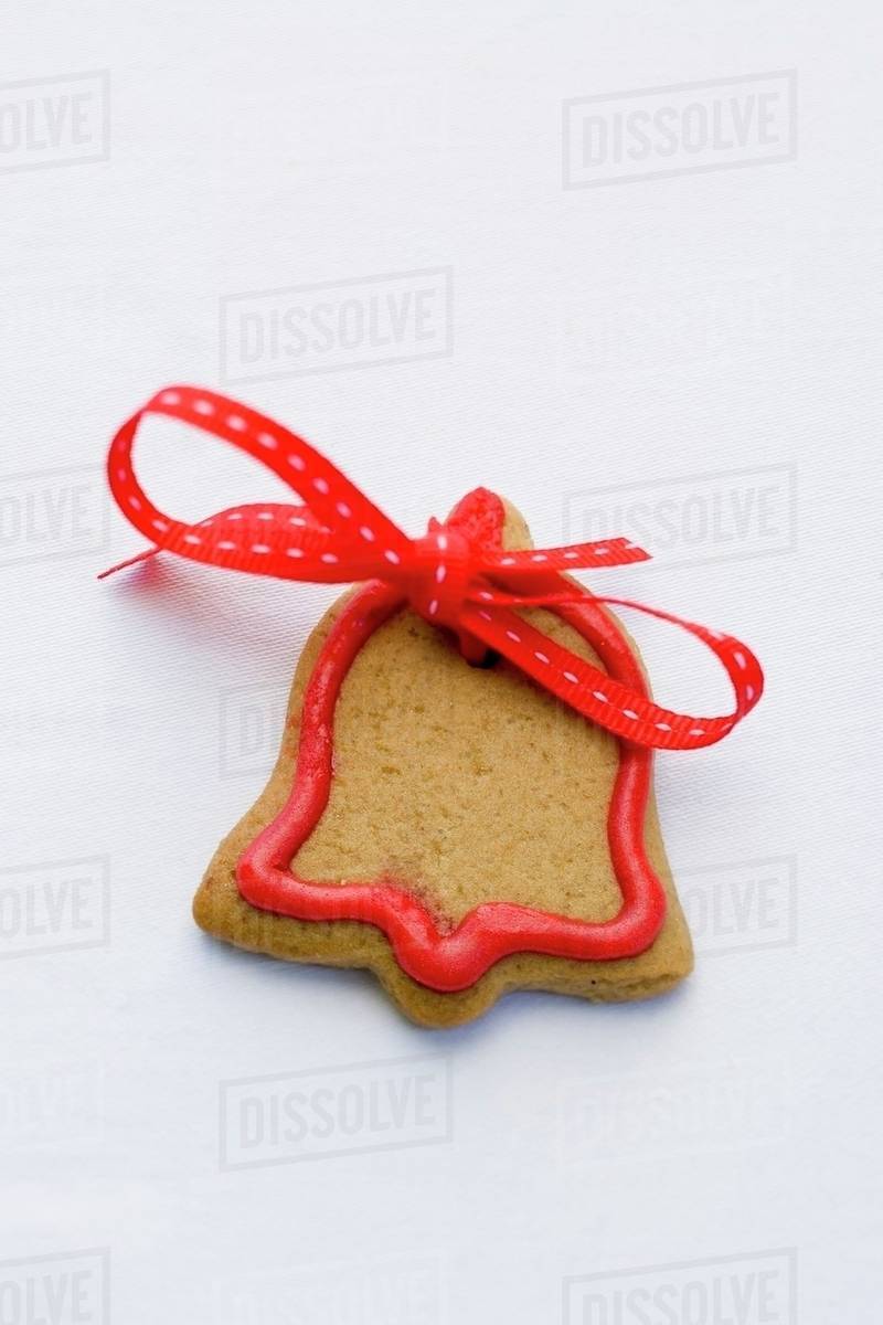 Bell-shaped Christmas biscuit with red bow - Royalty-free Stock Photo ...