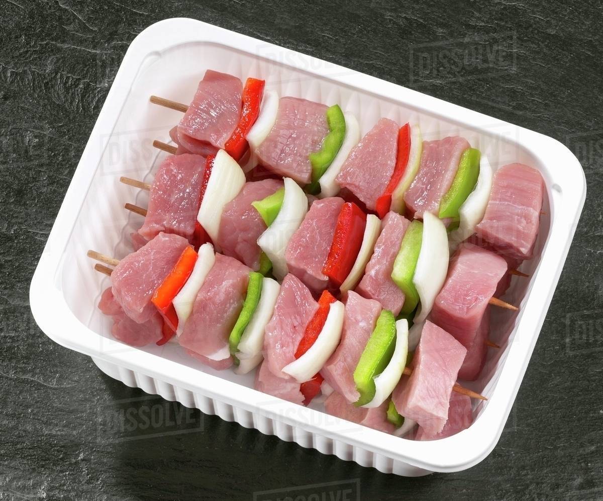 Meat kebabs in plastic container - Stock Photo - Dissolve