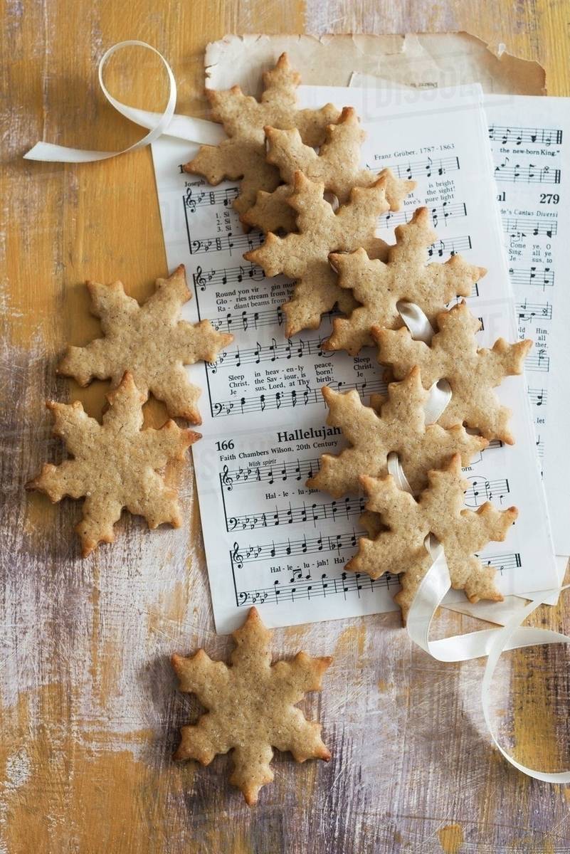 Gingerbread biscuits on sheet music - Royalty-free Stock Photo | Dissolve