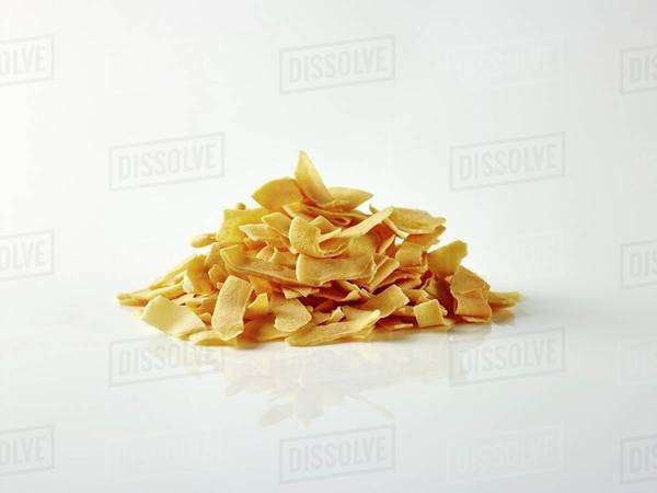 A pile of coconut crisps - Royalty-free Stock Photo | Dissolve