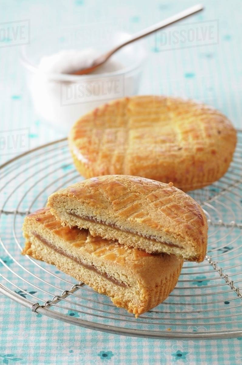 Breton butter cake, whole and halved - Royalty-free Stock Photo | Dissolve