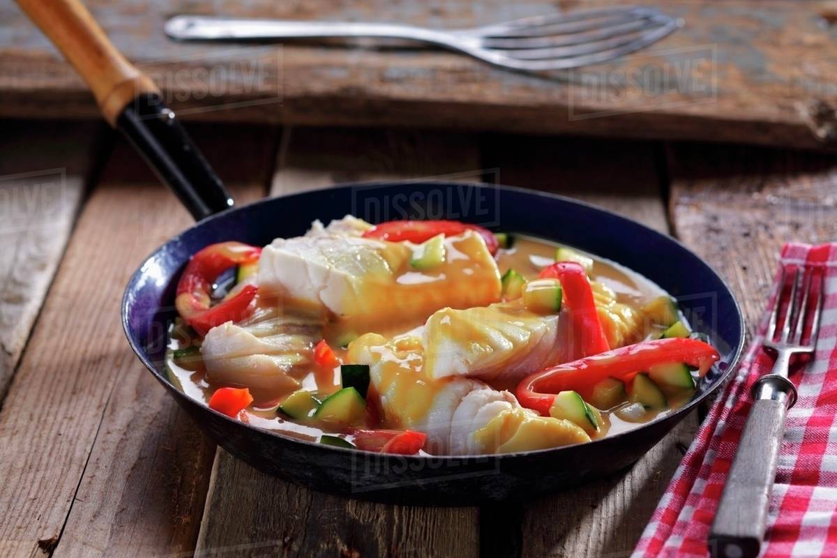 Pan-cooked fish with peppers and courgette - Royalty-free Stock Photo ...