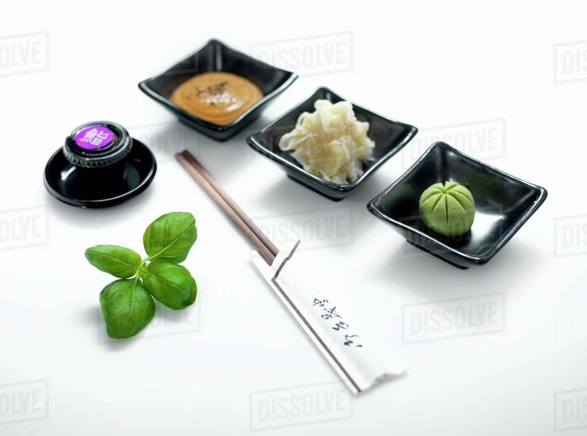 Sushi dips, pickled ginger and wasabi paste - Stock Photo - Dissolve