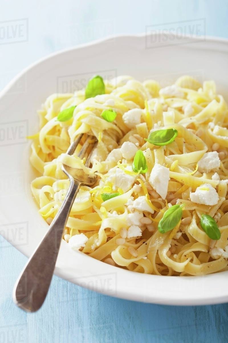 Tagliatelle with feta, lemon and basil - Royalty-free Stock Photo ...