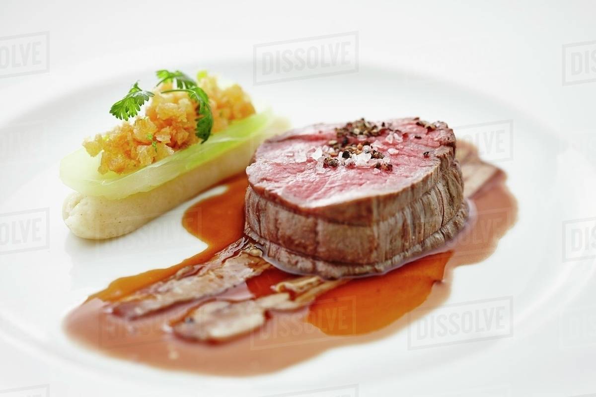 A beef medallion on bacon with salt and pepper - Royalty-free Stock ...