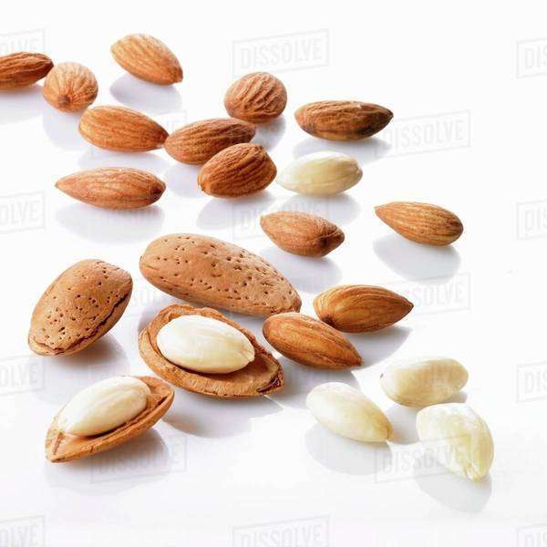 Almonds, unshelled and shelled - Stock Photo - Dissolve