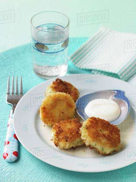 Mini Fish Cakes with Dipping Sauce; Fork and Glass of Water - Royalty ...