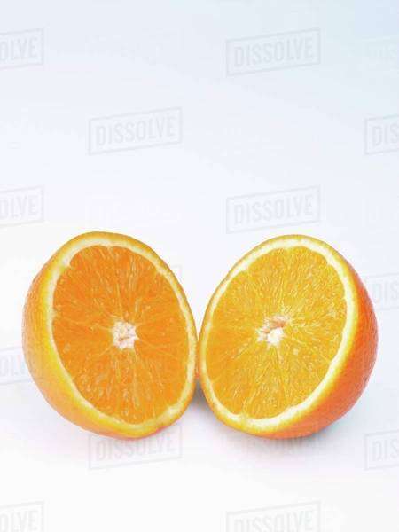 Two orange halves - Stock Photo - Dissolve