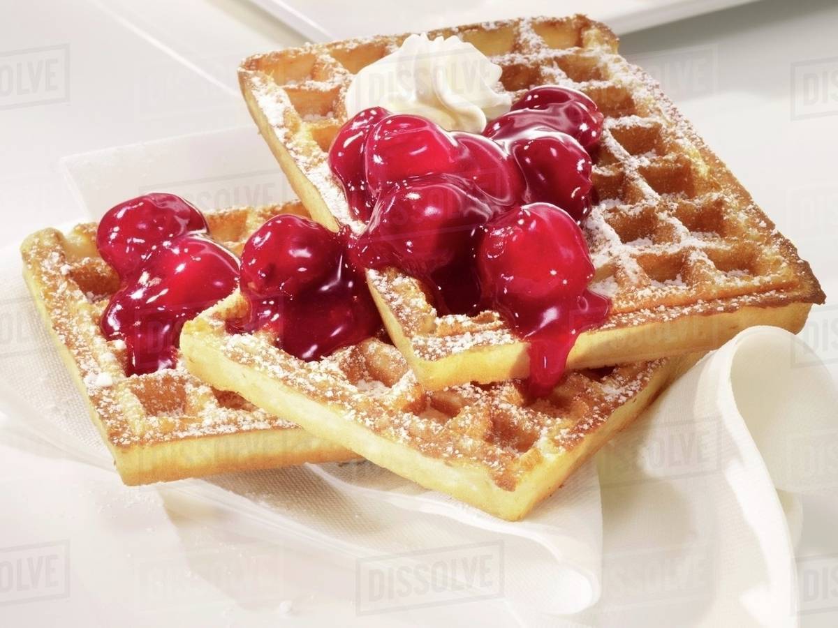 Waffles with cherries and cream - Royalty-free Stock Photo | Dissolve
