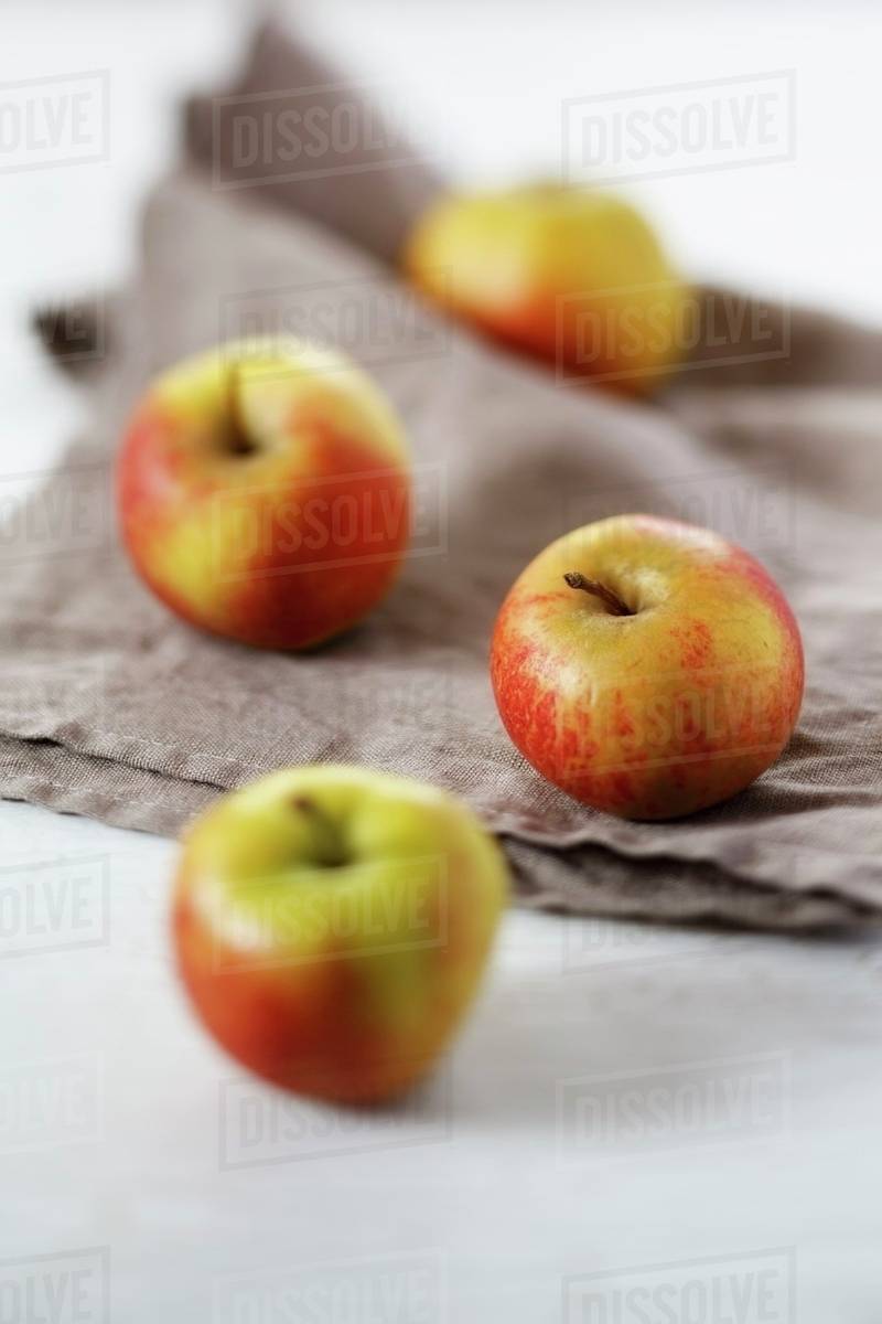 Four Marnica apples - Stock Photo - Dissolve
