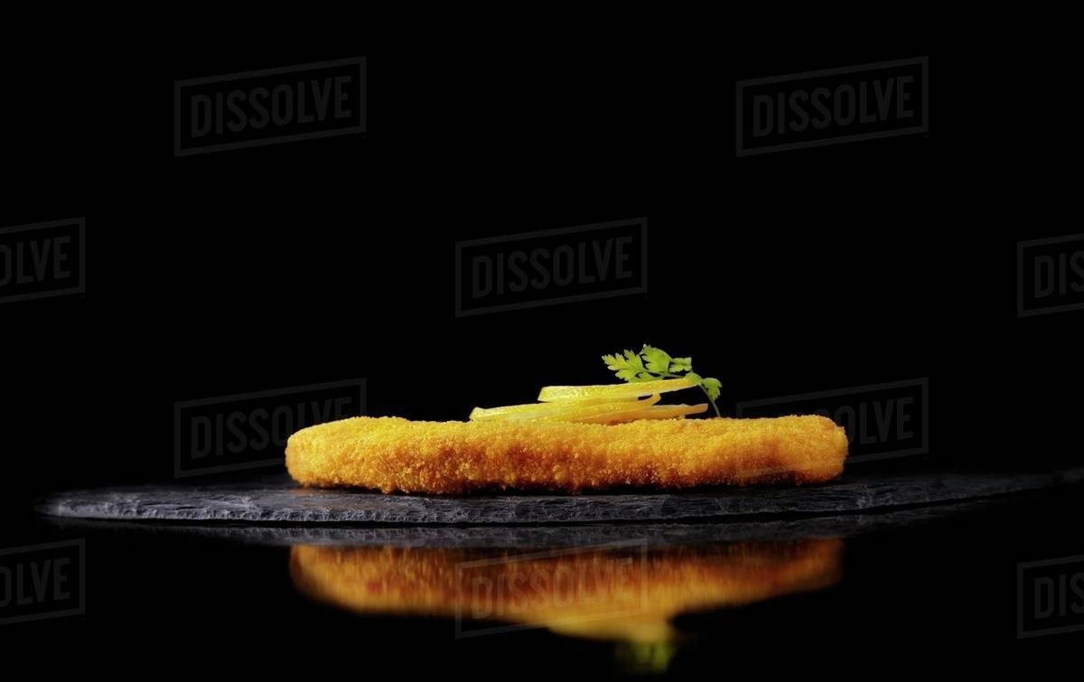 Breaded escalope on a slate platter - Royalty-free Stock Photo | Dissolve
