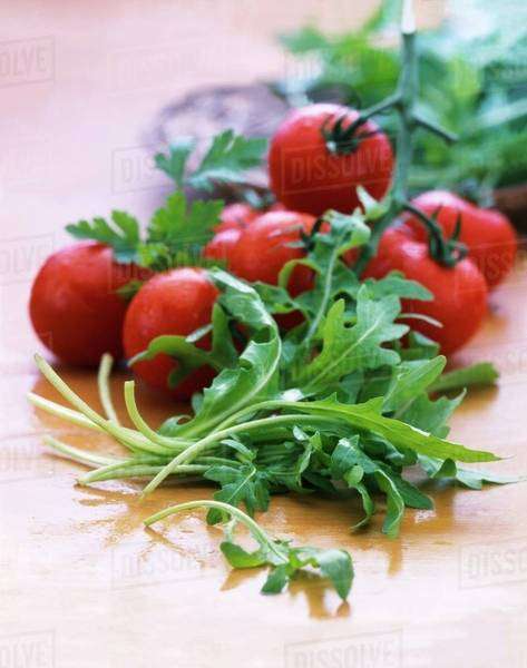 Tomatoes and rocket - Royalty-free Stock Photo | Dissolve