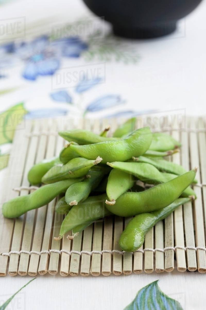 Cooked soya beans on a bamboo mat (Japan) - Stock Photo - Dissolve