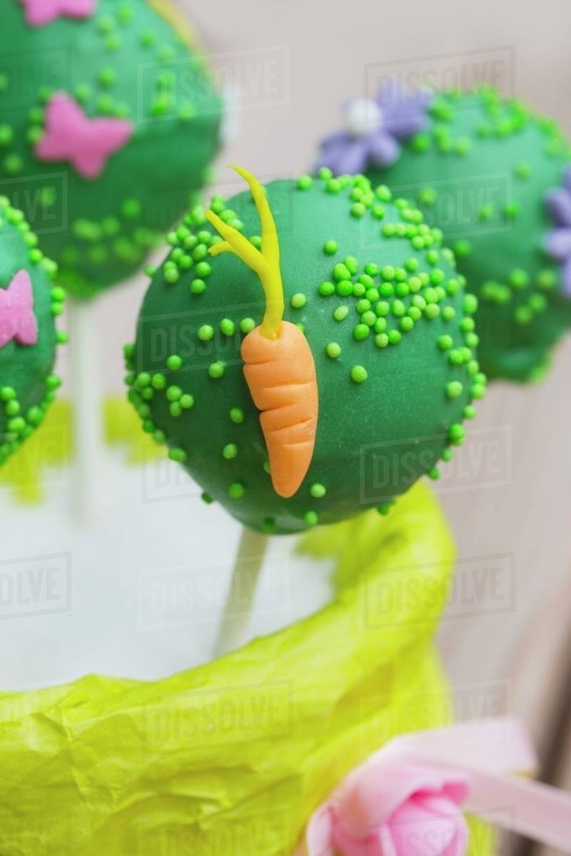 A green cake pop decorated with a carrot - Royalty-free Stock Photo ...