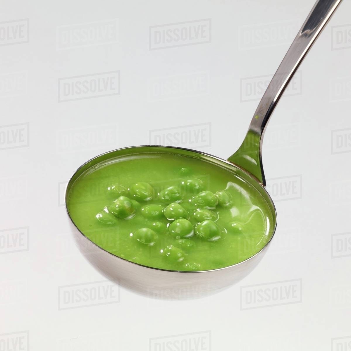 Pea soup in a ladle - Stock Photo - Dissolve