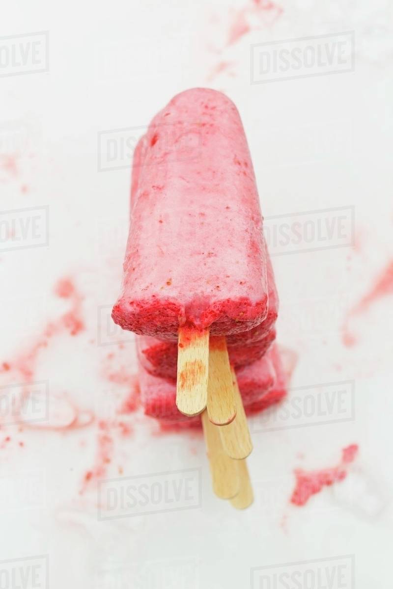 A stack of strawberry ice cream sticks - Stock Photo - Dissolve
