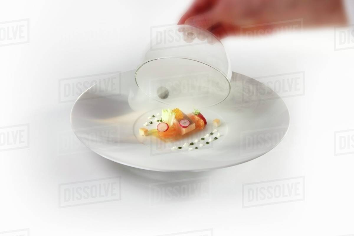 An arrangement of char confir, caviar, tartar and rollmop herring ...