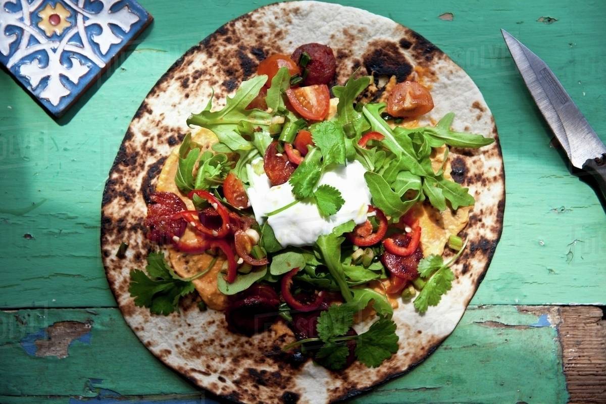 A toasted tortilla with a mixed topping - Royalty-free Stock Photo ...