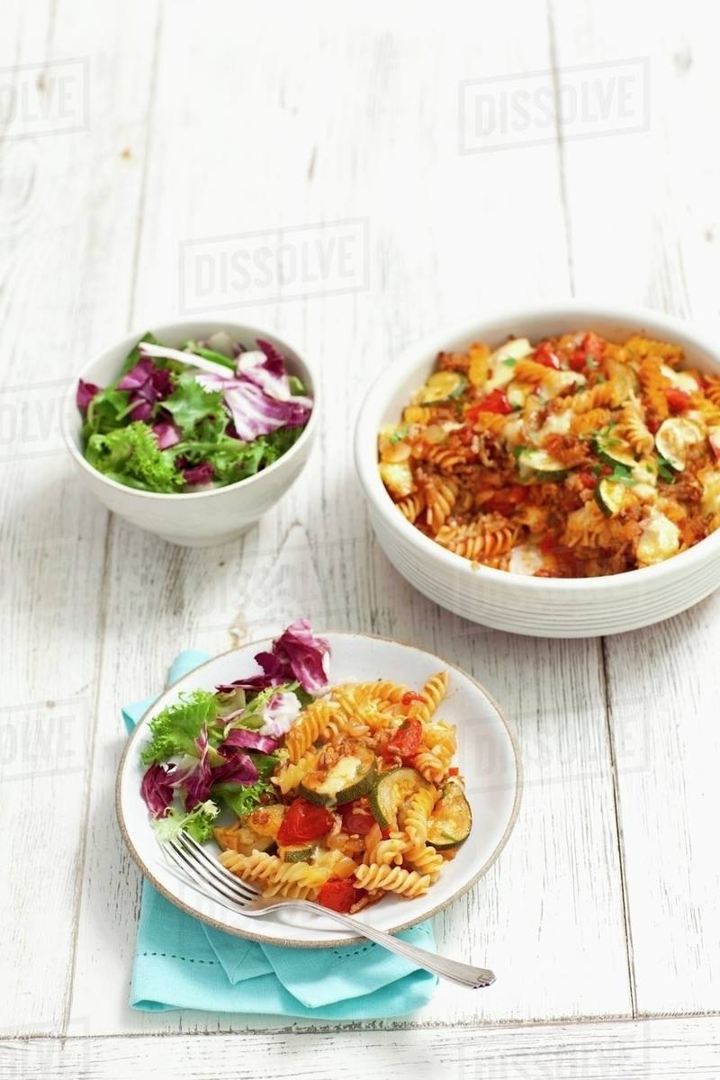 Fusilli bake with minced meat, courgettes and tomatoes - Stock Photo ...