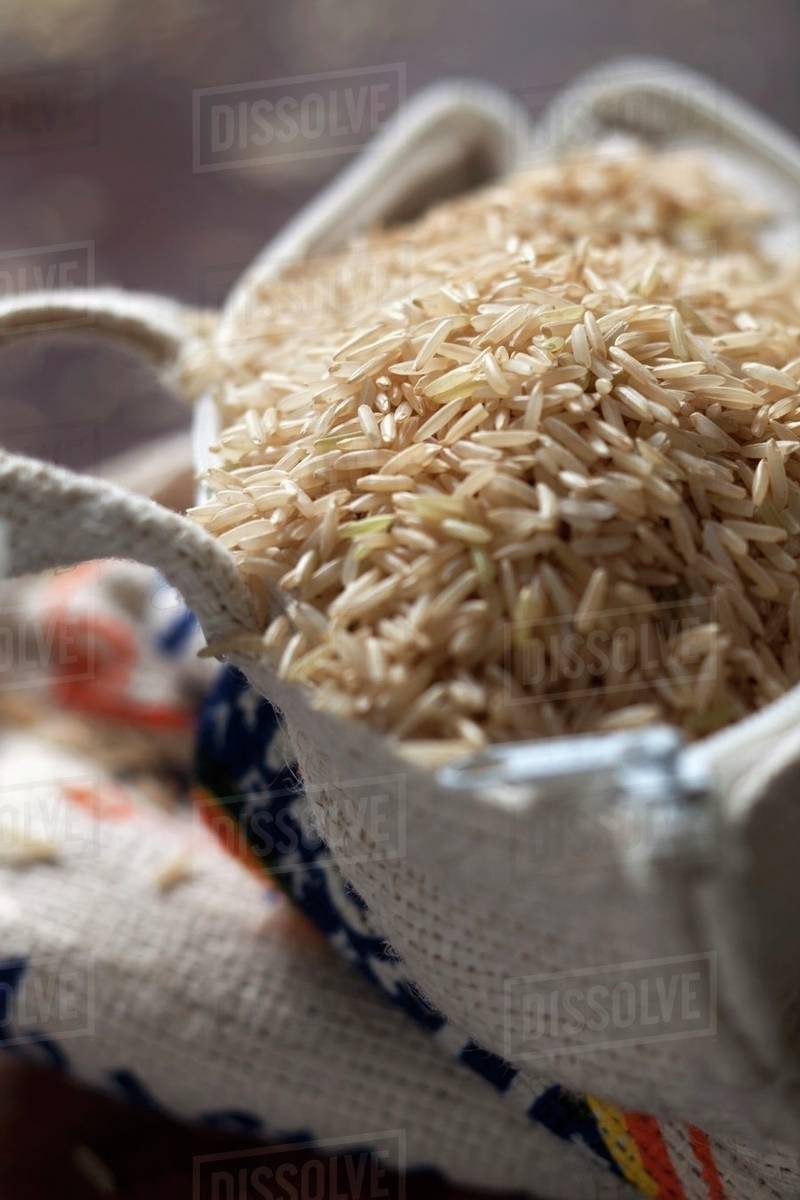 Long grain rice in a jute sack - Stock Photo - Dissolve