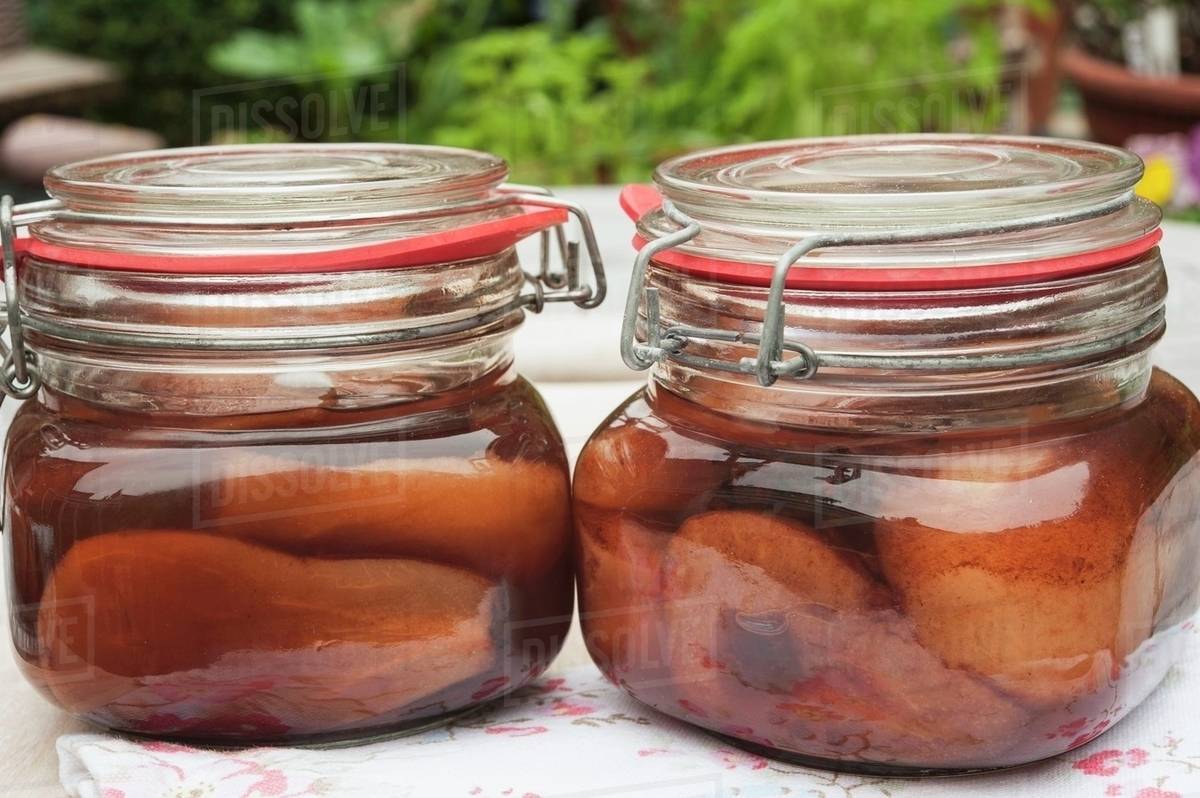 Two jars of pears in cherry brandy outside - Royalty-free Stock Photo ...