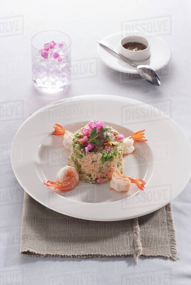 Fried rice with edible flowers and prawns (Thailand) - Royalty-free ...