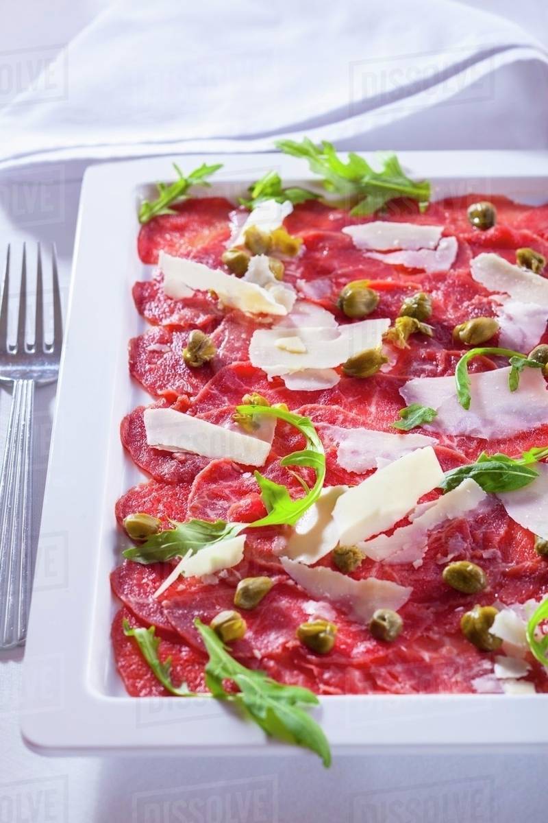Carpaccio (slices of raw beef with capers and Parmesan cheese, Italy ...