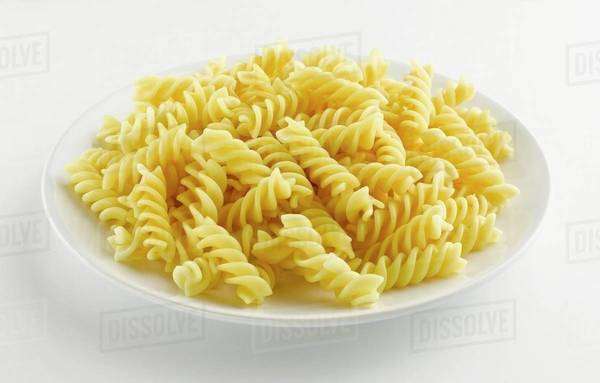 A plate of cooked fusilli - Royalty-free Stock Photo | Dissolve