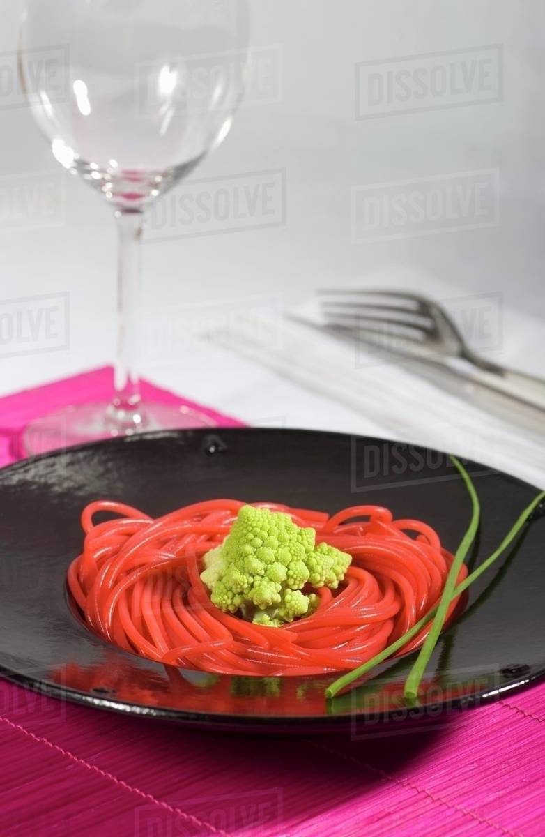 Pink colored spaghetti with Romanesco - Royalty-free Stock Photo | Dissolve