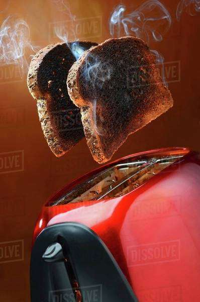 Smoking burnt toast popping out of a red toaster - Royalty-free Stock ...