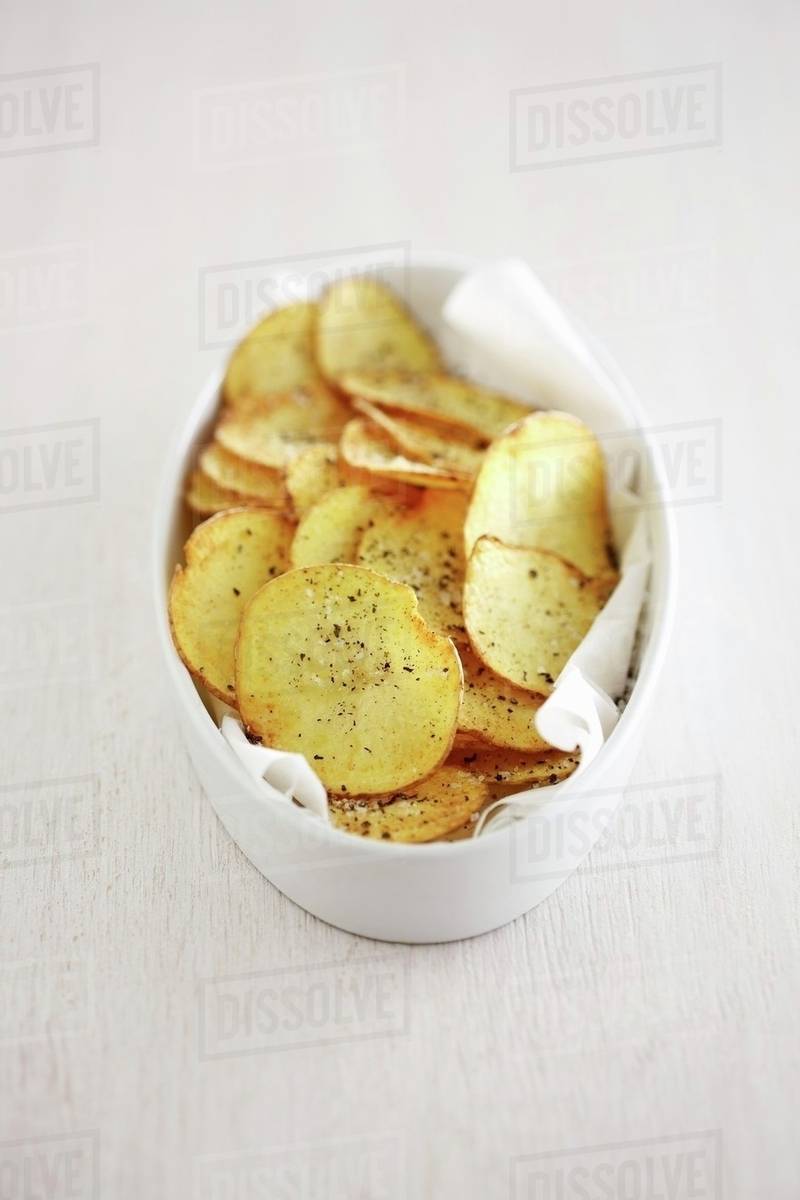 Homemade potato crisps - Royalty-free Stock Photo | Dissolve