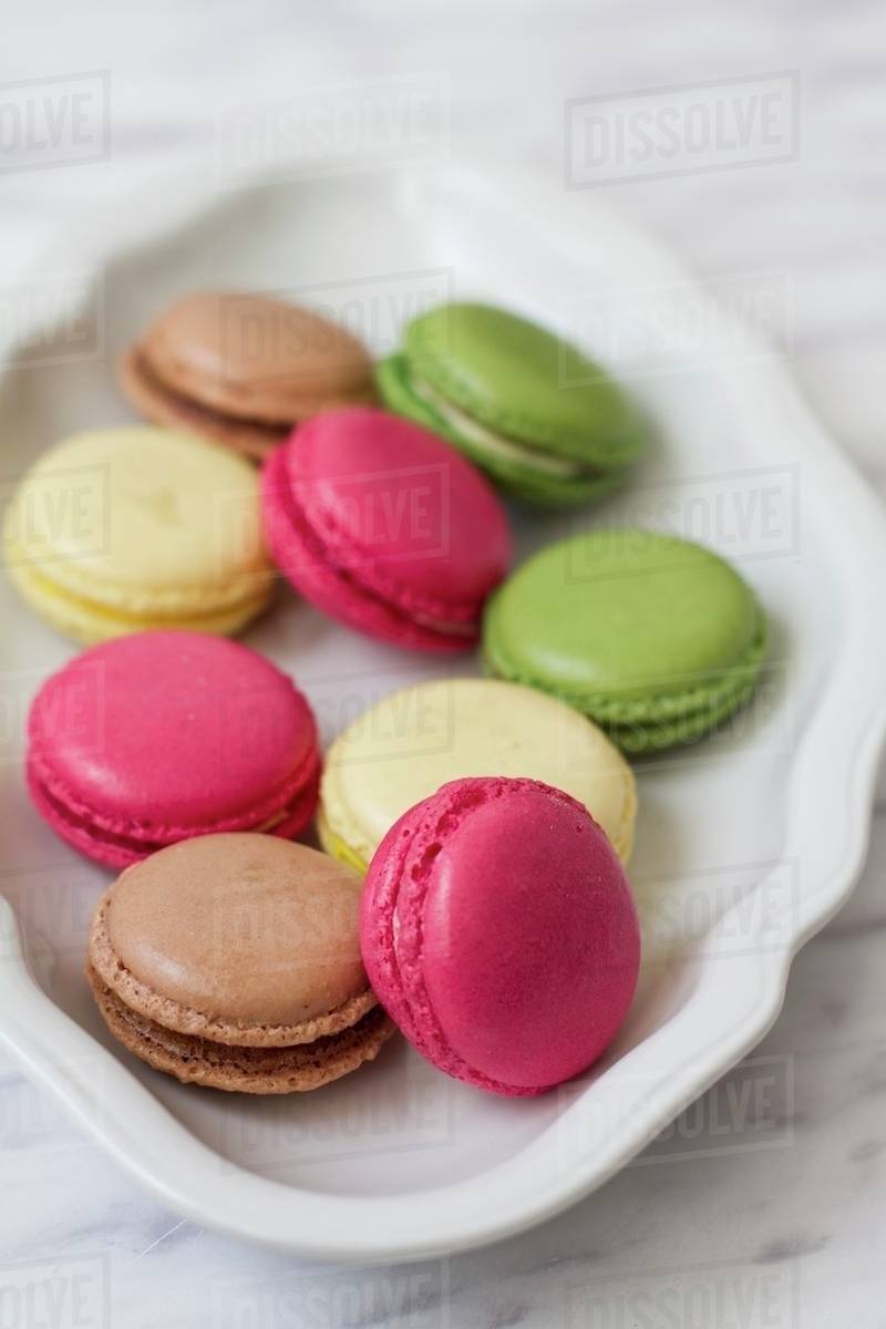 Various different coloured macaroons on a plate - Royalty-free Stock ...