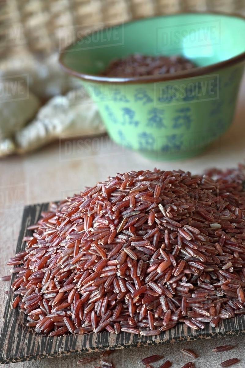 Red rice on a wooden coconut dish (Asia) - Royalty-free Stock Photo ...