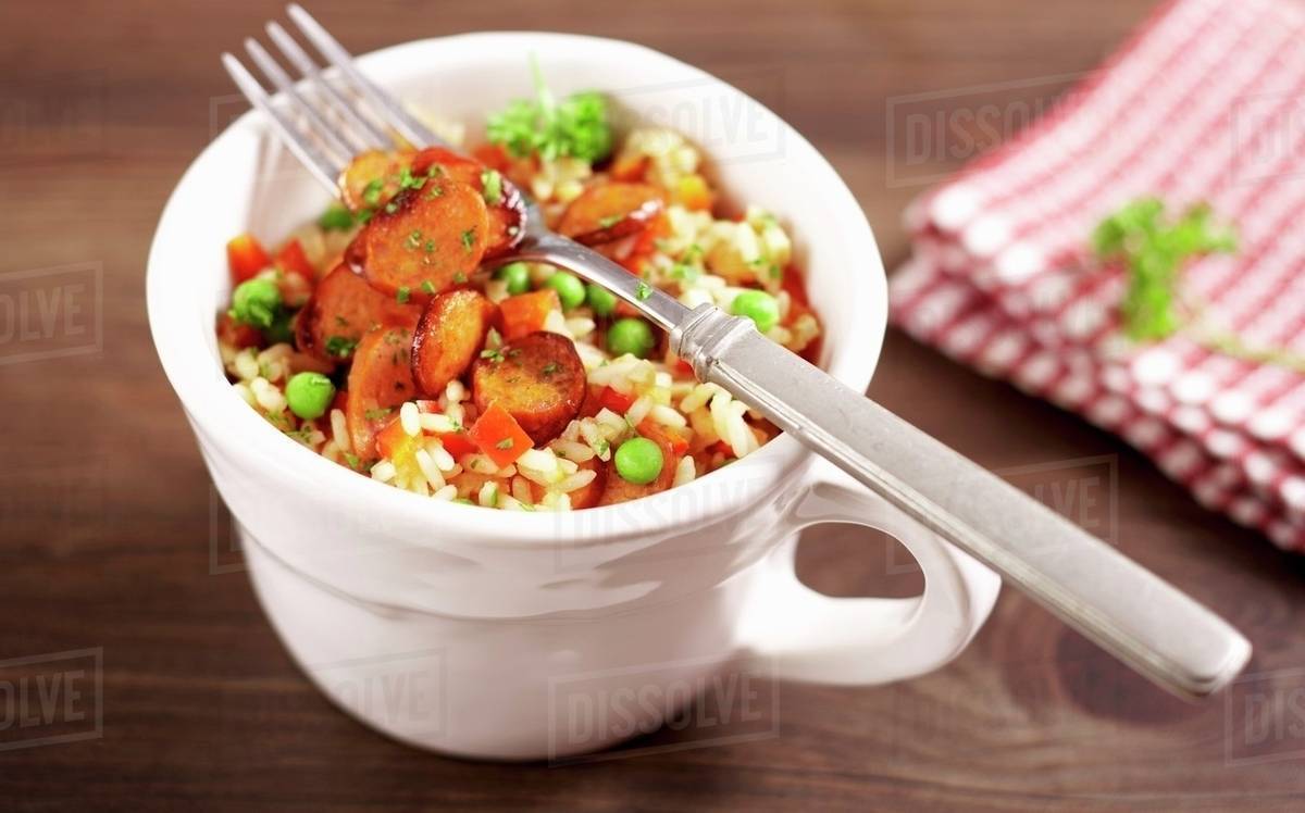 Colourful rice with Hungarian debrecener sausages - Royalty-free Stock ...