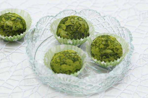 Matcha pralines with white chocolate - Stock Photo - Dissolve