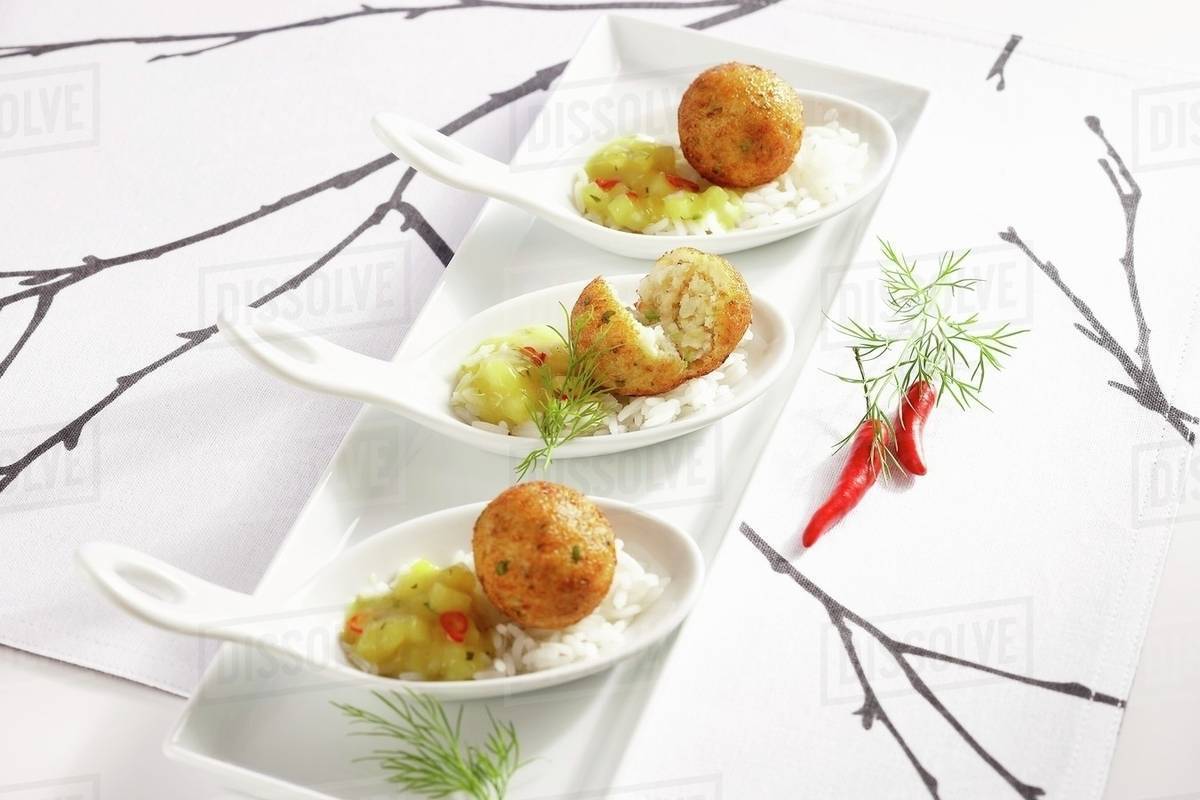 Cod balls in a fruity curry sauce on a bed of rice (Asia) - Royalty ...