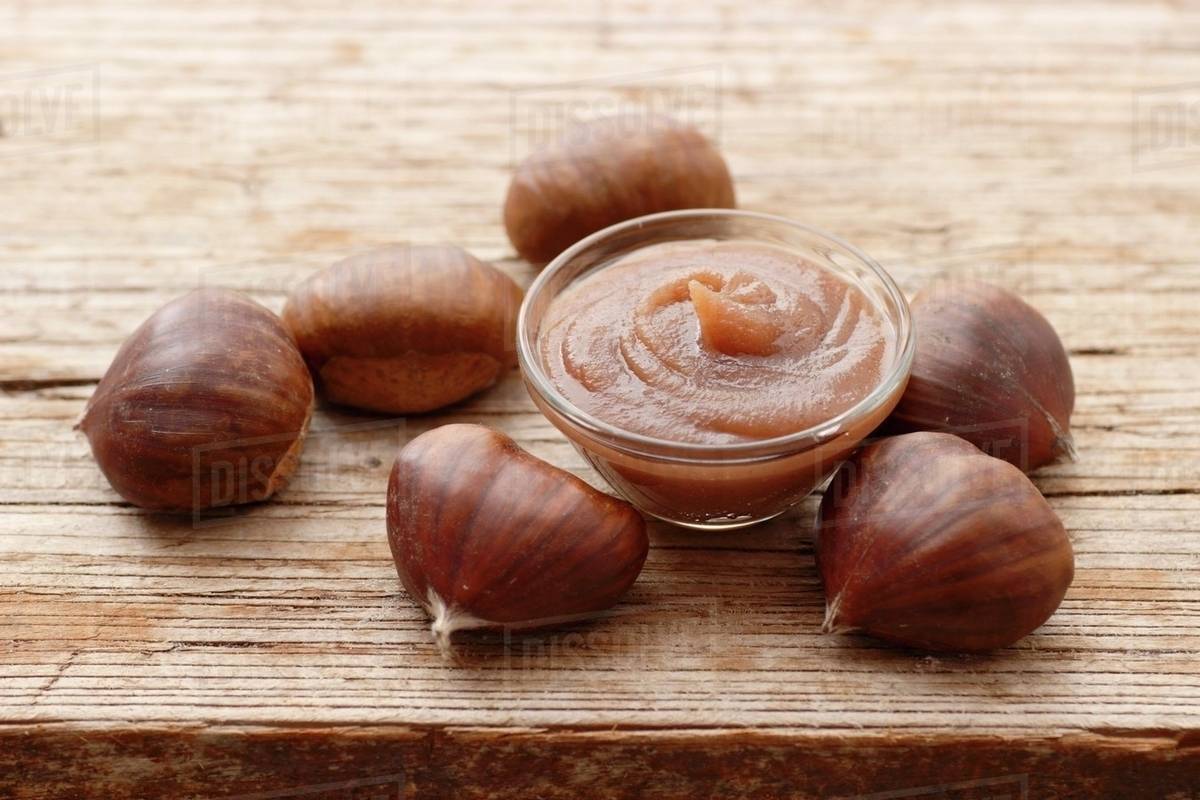Chestnut puree with some sweet chestnuts - Stock Photo - Dissolve