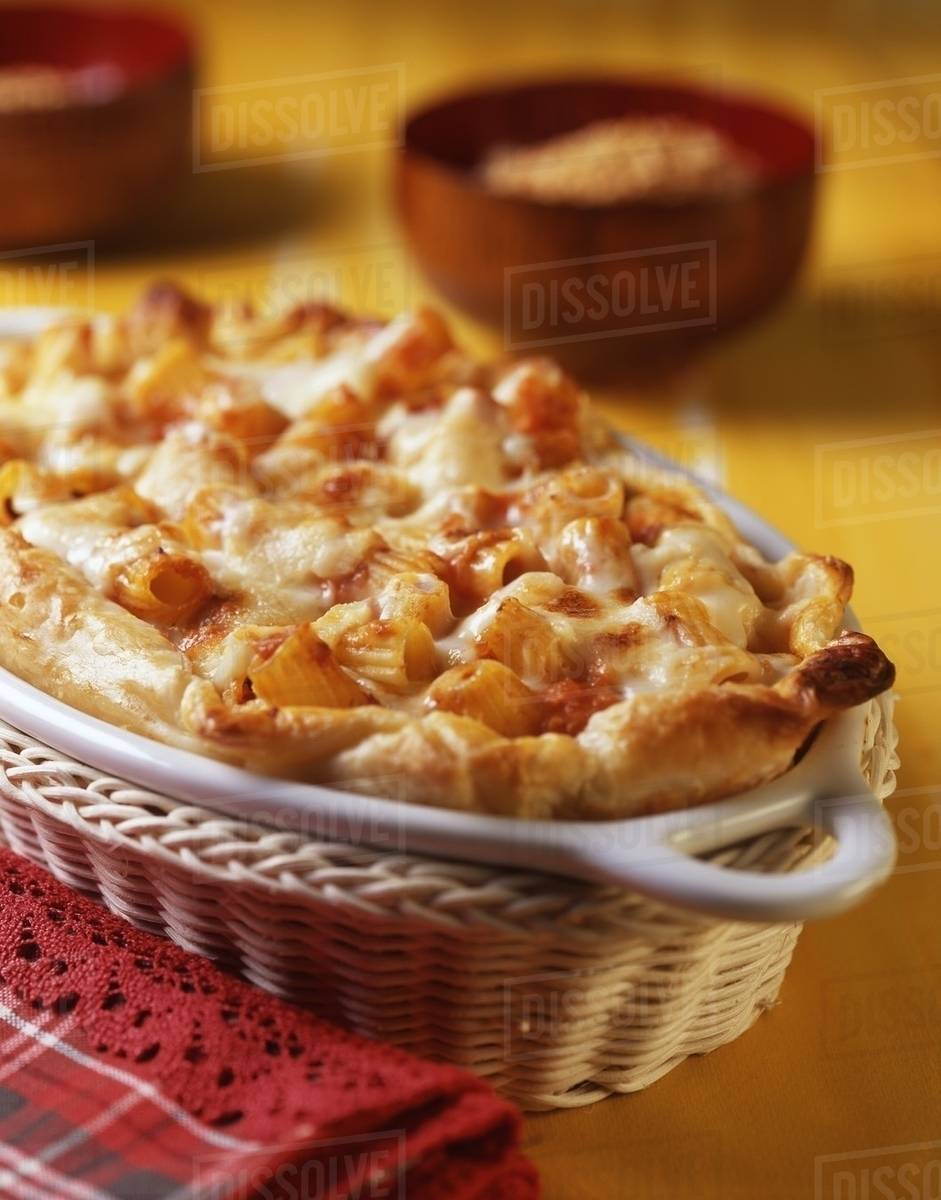 Pasta bake with sausage, bechamel and tomato sauce in puff pastry ...